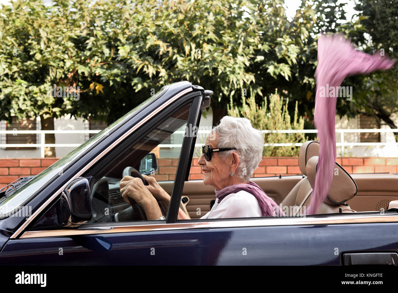 old woman driving a convertible car Stock Photo - Alamy