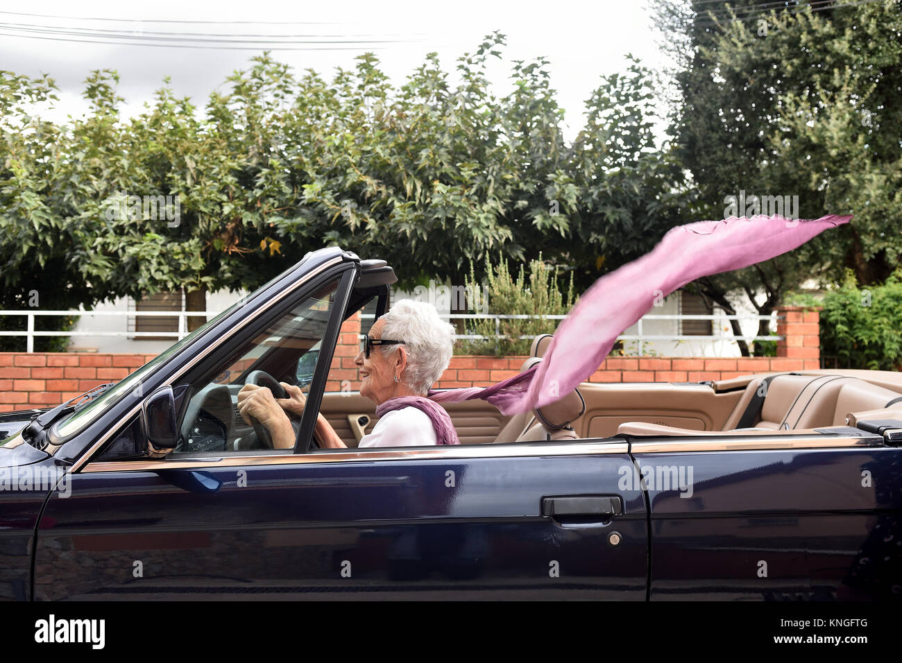 old woman driving a convertible car Stock Photo - Alamy