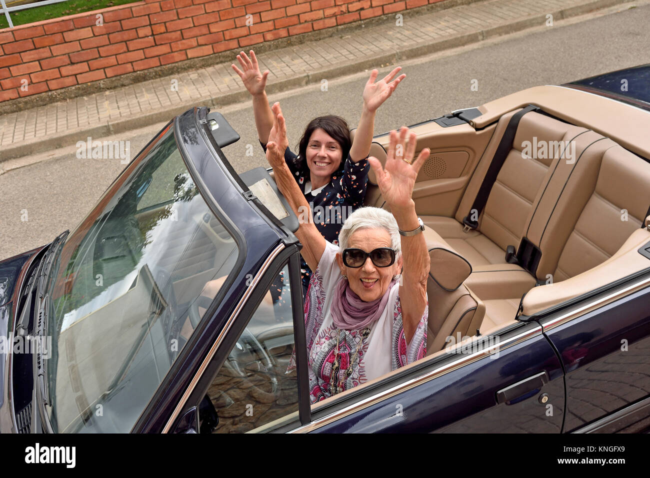 women of different generations happy in a convertible car Stock Photo ...