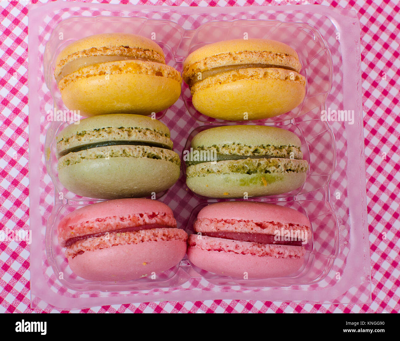 Colorful sweet macaroons on retro background Stock Photo - Alamy
