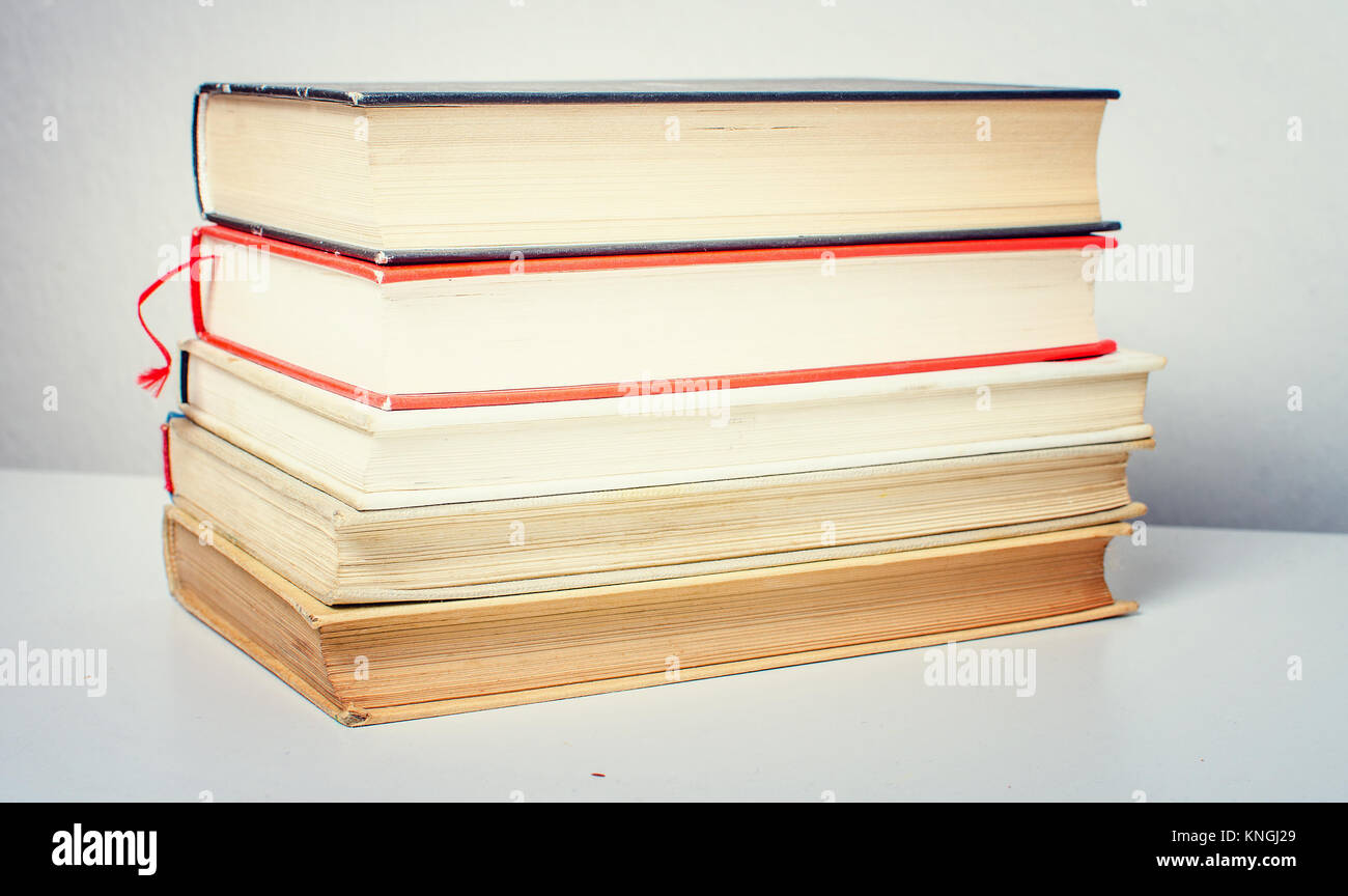 A pile of old, discarded books suited to learning Stock Photo - Alamy