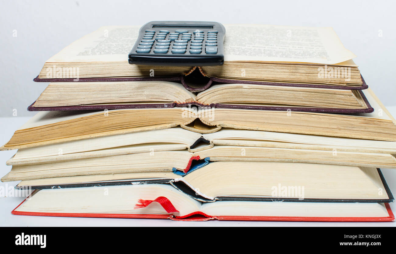 Pile text books calculator hi-res stock photography and images - Alamy