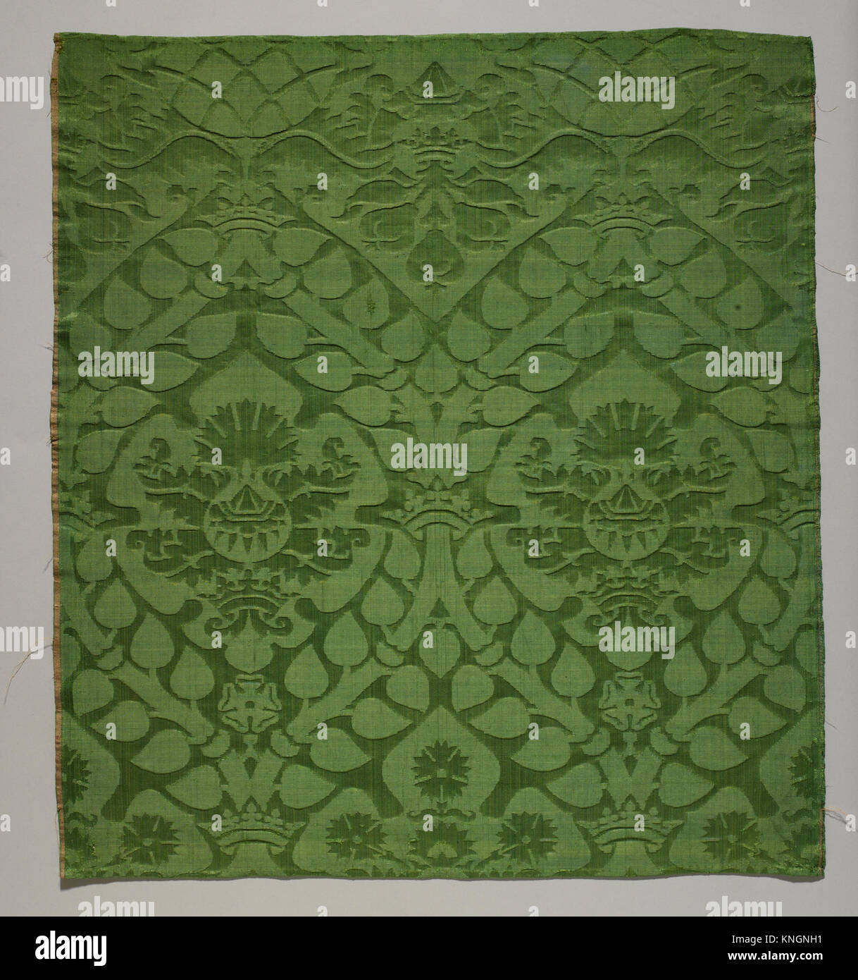 This fragment of damask fabric features marriage emblems, symbolizing ...