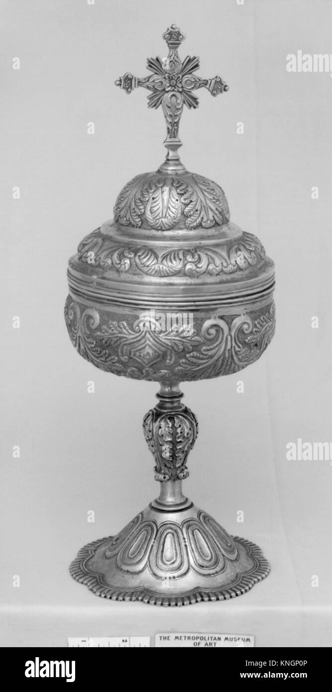 This ciborium, a liturgical vessel used to hold the Eucharist, reflects ...