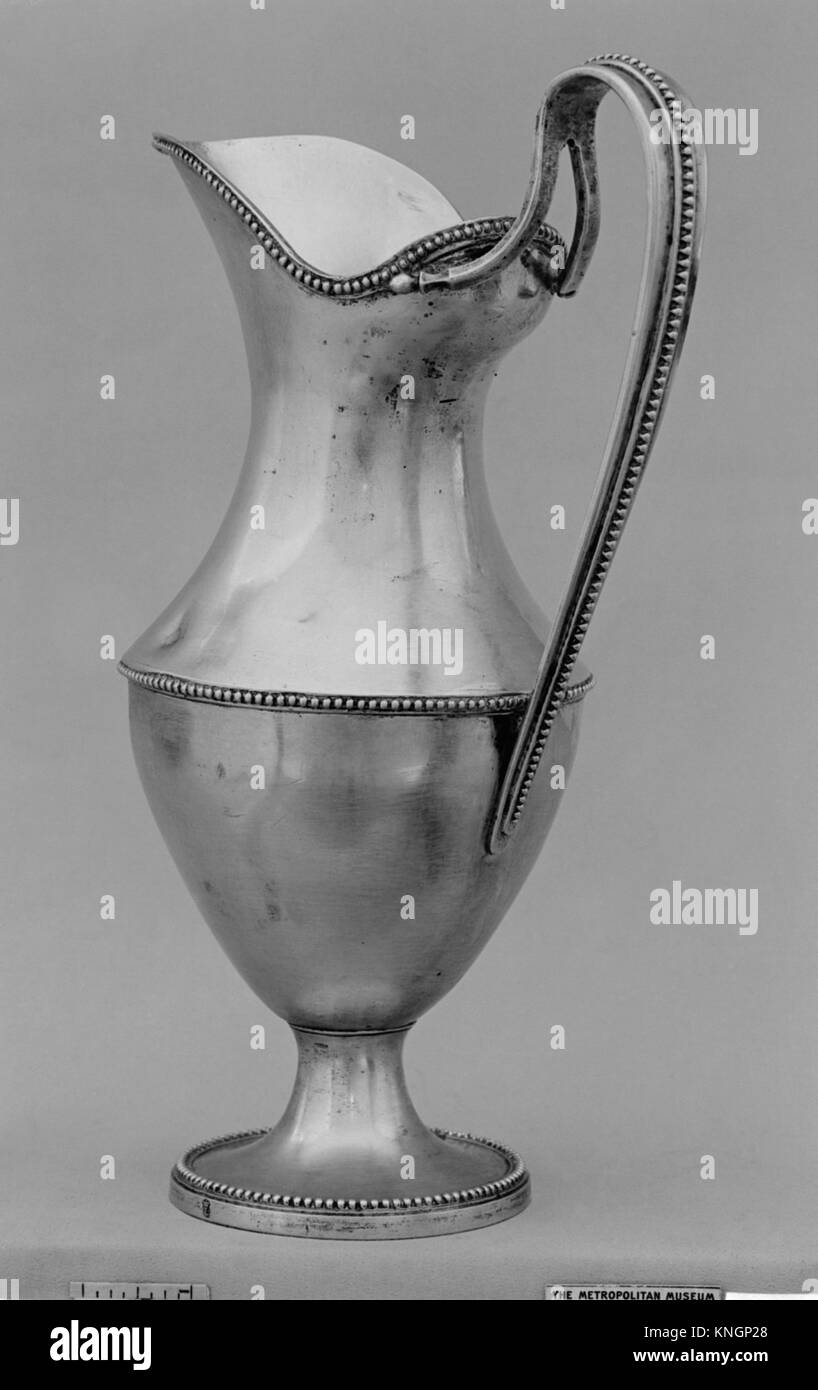 This ewer, made from fine materials, is used for pouring liquids. It ...