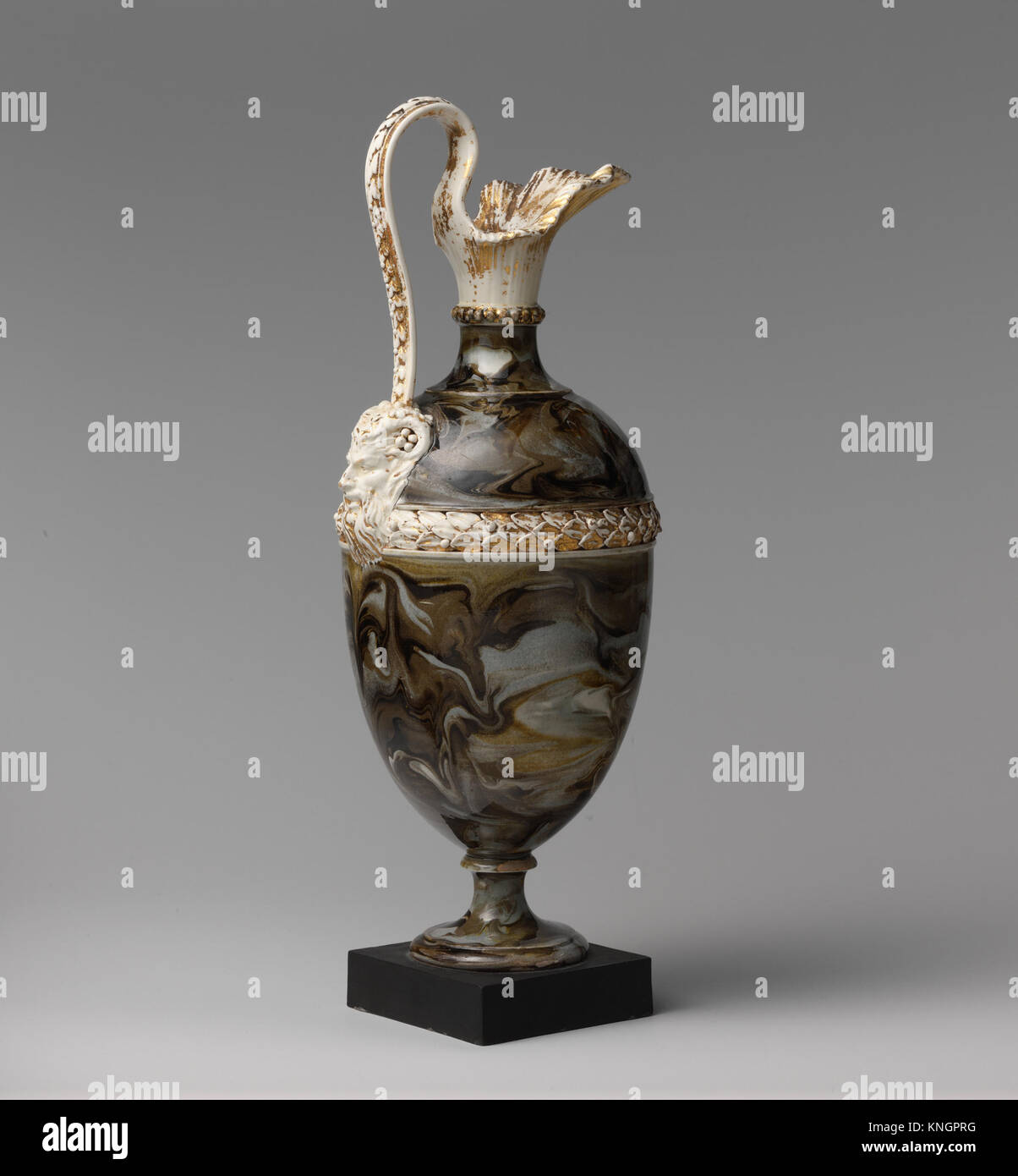 This ewer is a ceramic vessel with a handle and spout, often used for ...