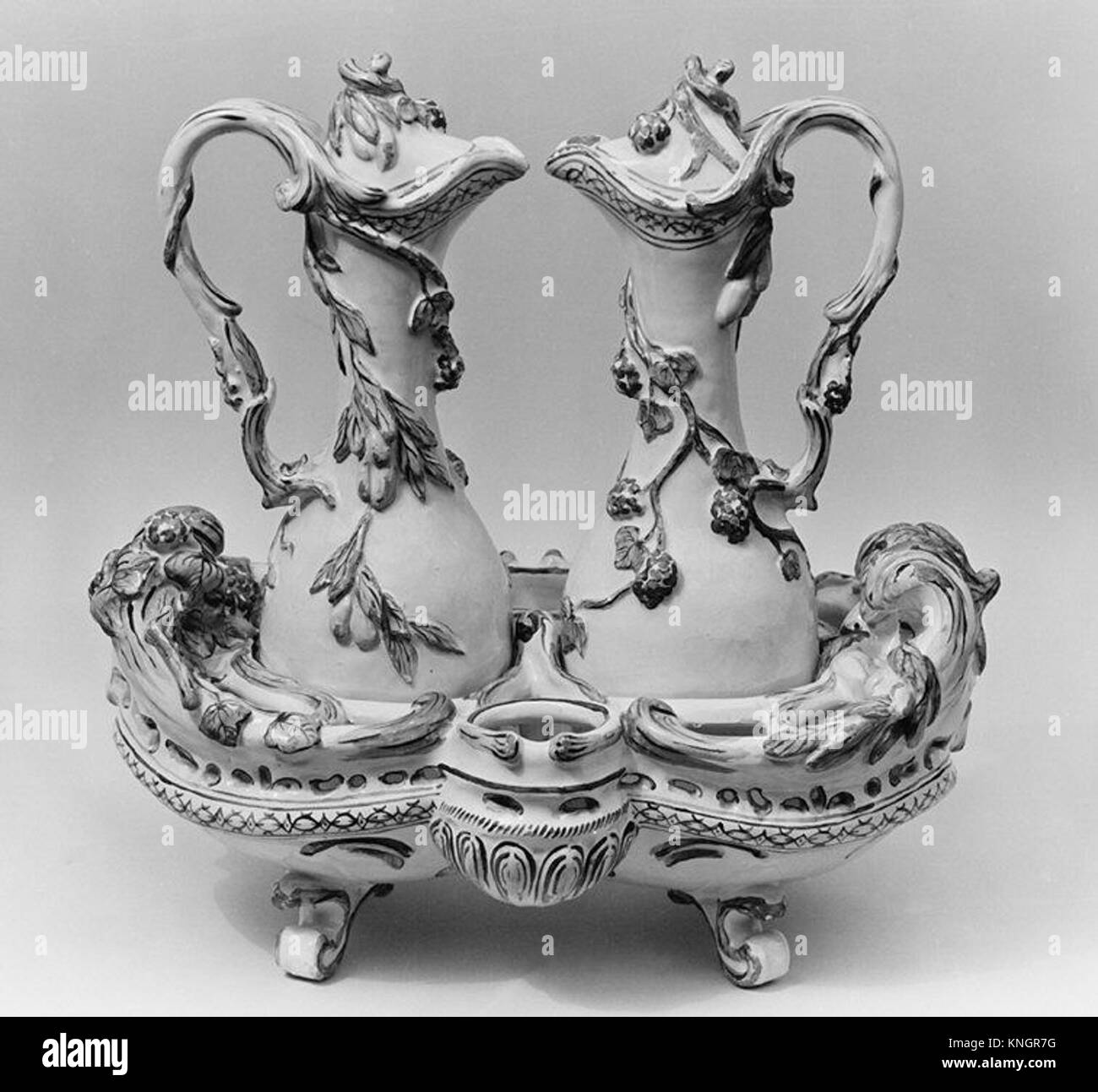 This cruet frame, along with its two accompanying cruets and covers, is ...