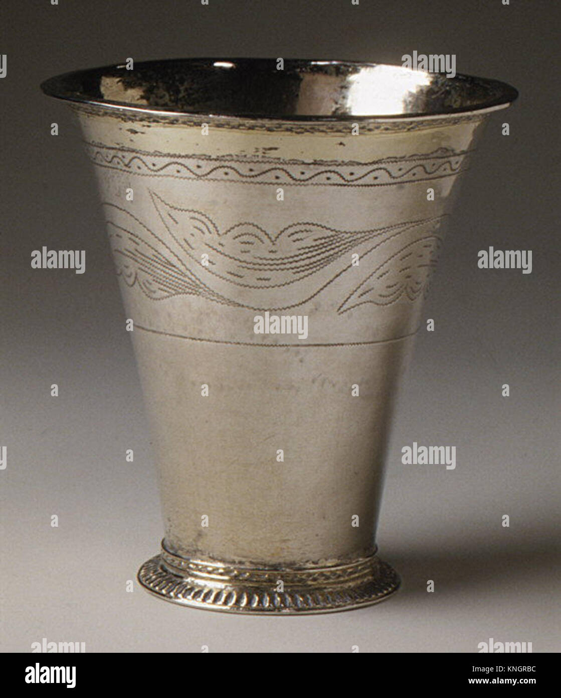 This cup or beaker is crafted from fine material and exhibits the ...