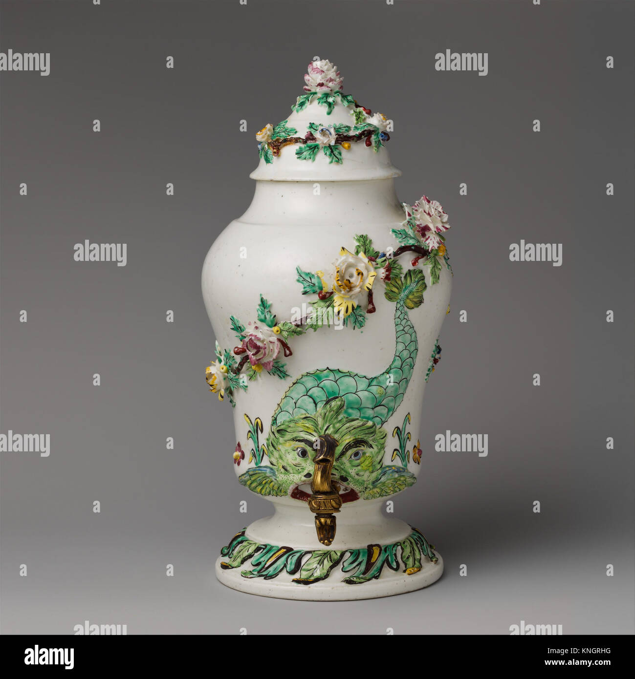 This fountain, complete with a cover and spigot, is a functional and ...