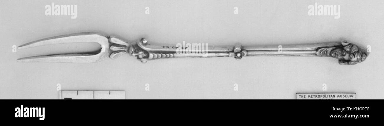 This historical fork, crafted from metal, represents the dining ...