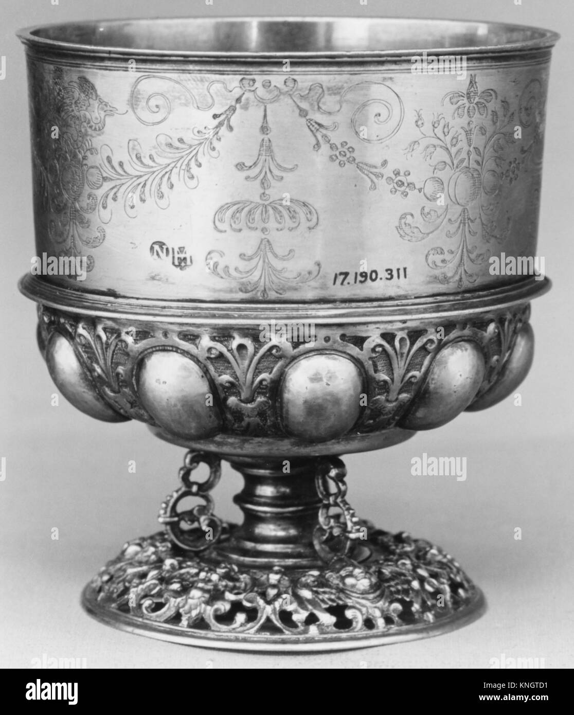 A historical cup featuring detailed craftsmanship and design. This ...