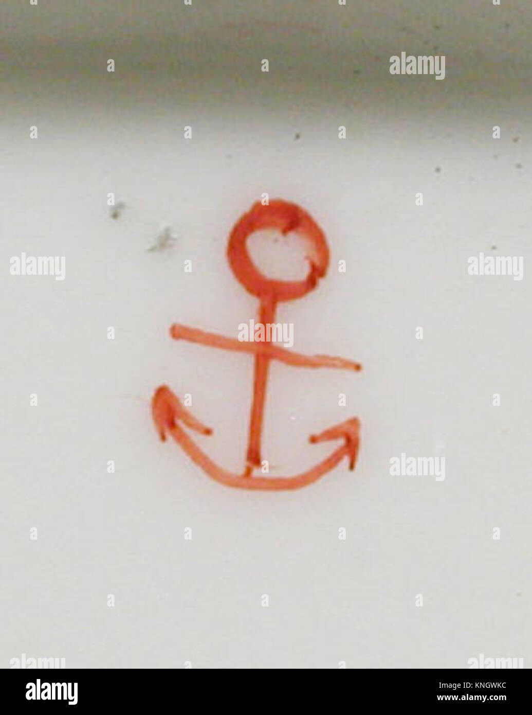 This dish, likely made of ceramic or metal, features distinctive marks ...