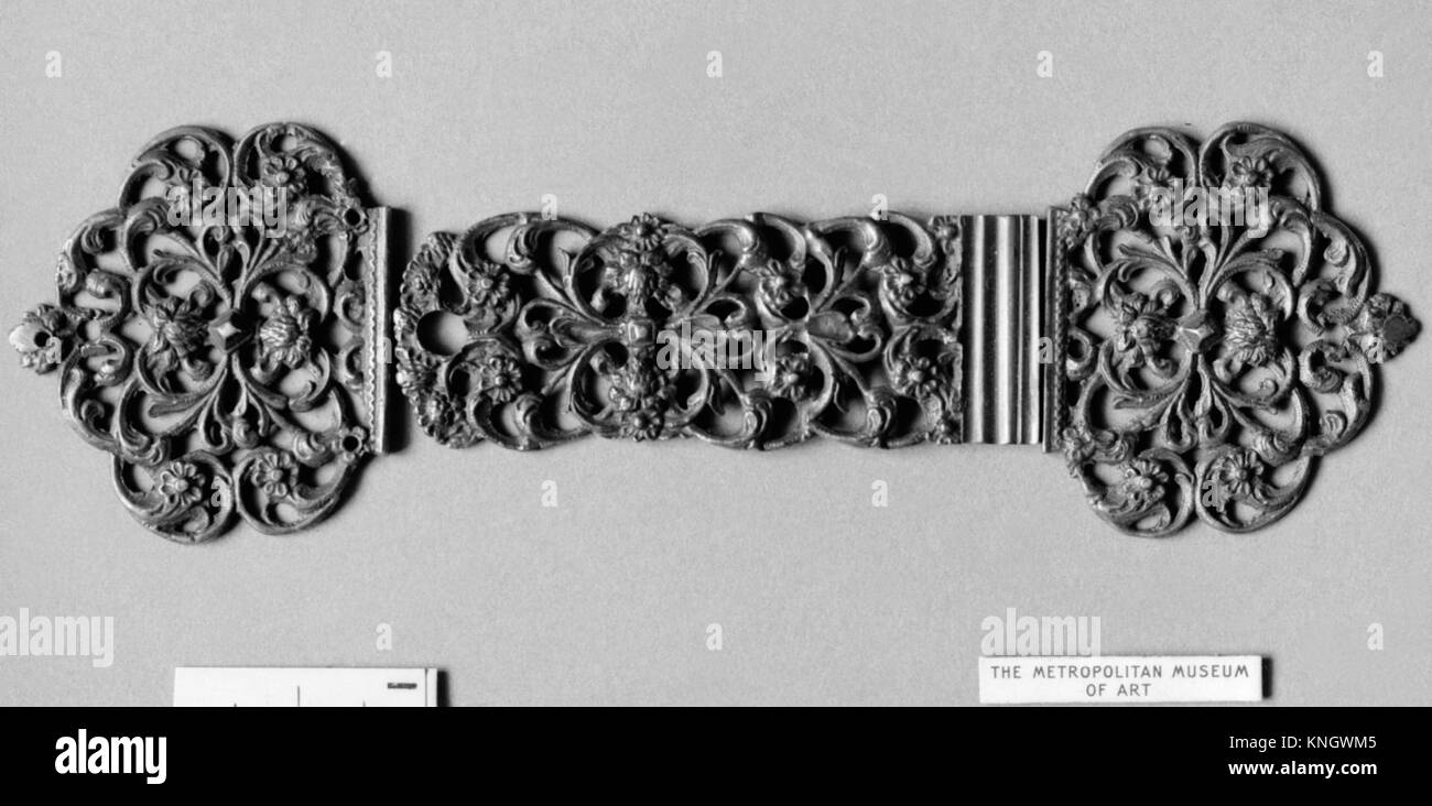 This book clasp, used to secure the pages of a manuscript, reflects the ...