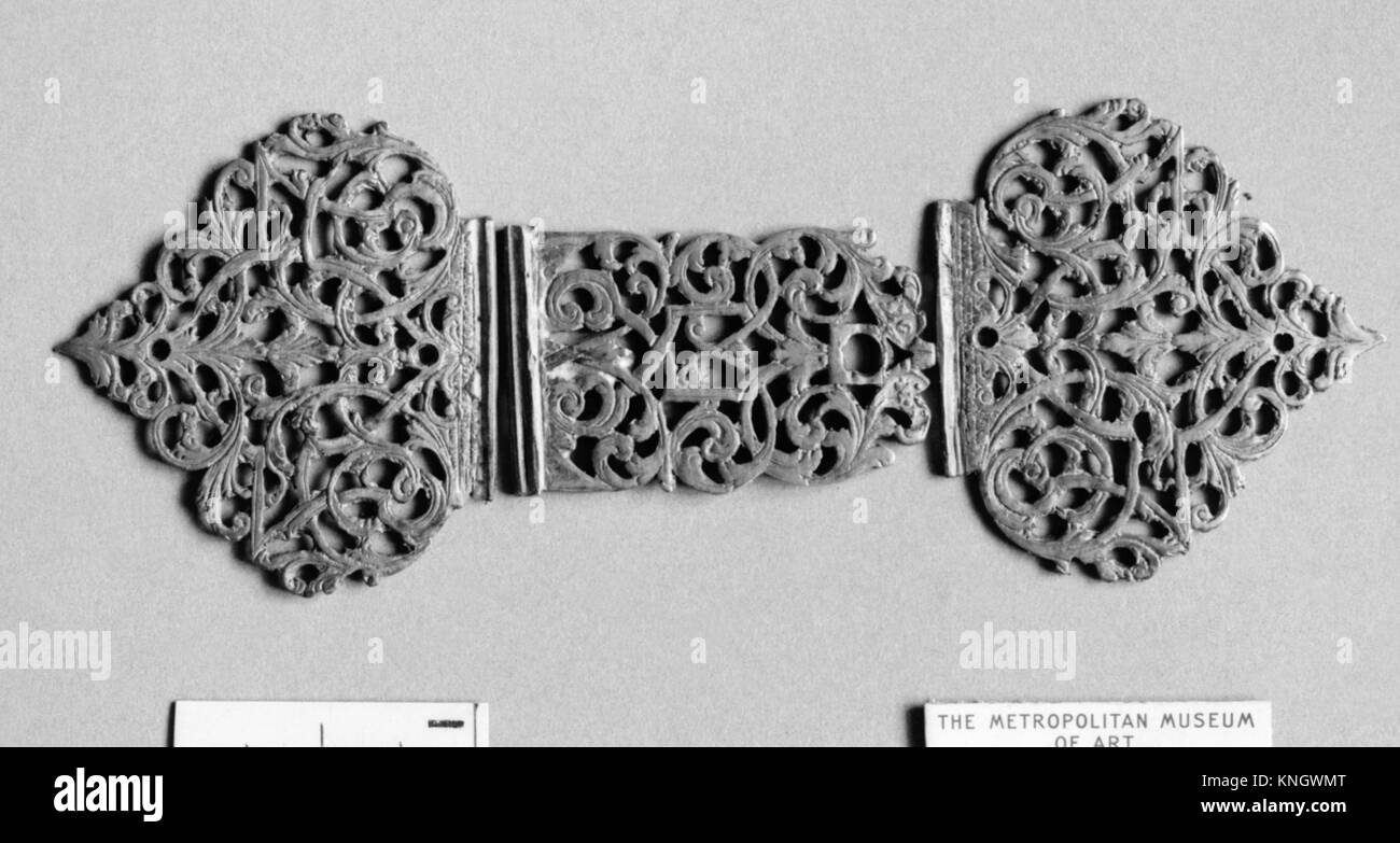 This book clasp is an ornate fastening device designed to secure the ...