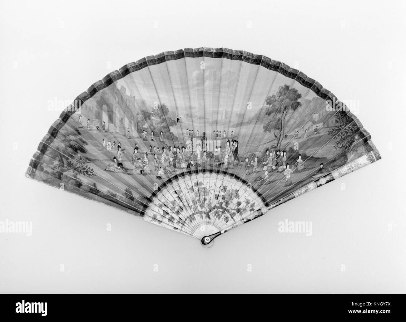 This fan, crafted with delicate materials, serves both a decorative and ...