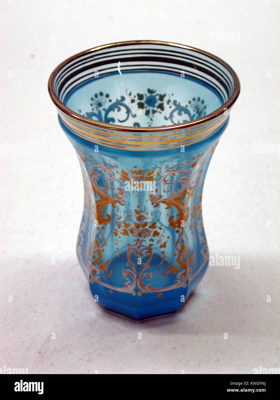 This beaker, likely for drinking, showcases unique craftsmanship and ...