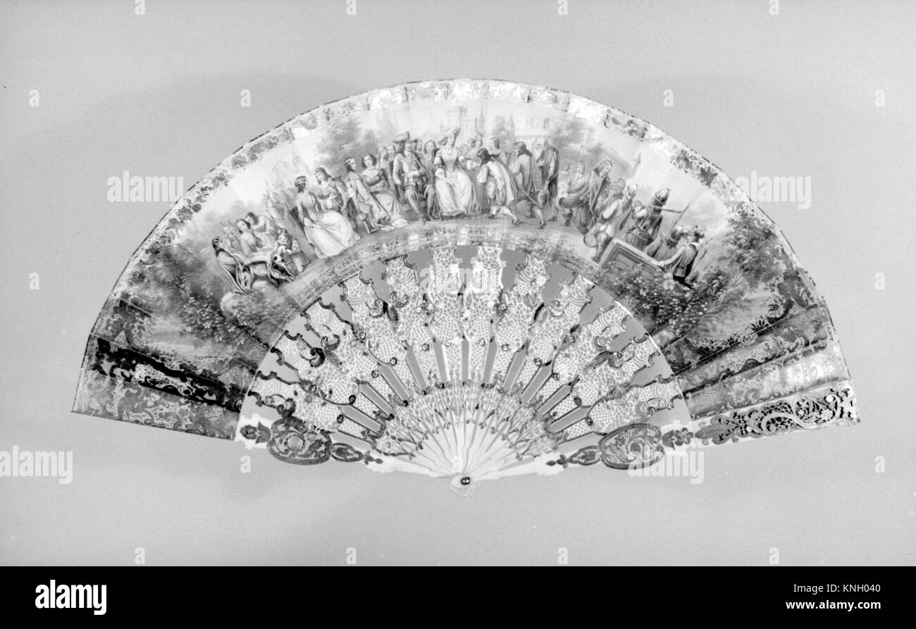 This fan, crafted with delicate materials and intricate design, serves ...