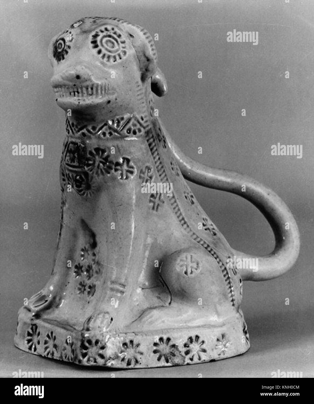 This sculpture or artwork depicts a dog, highlighting the role of ...