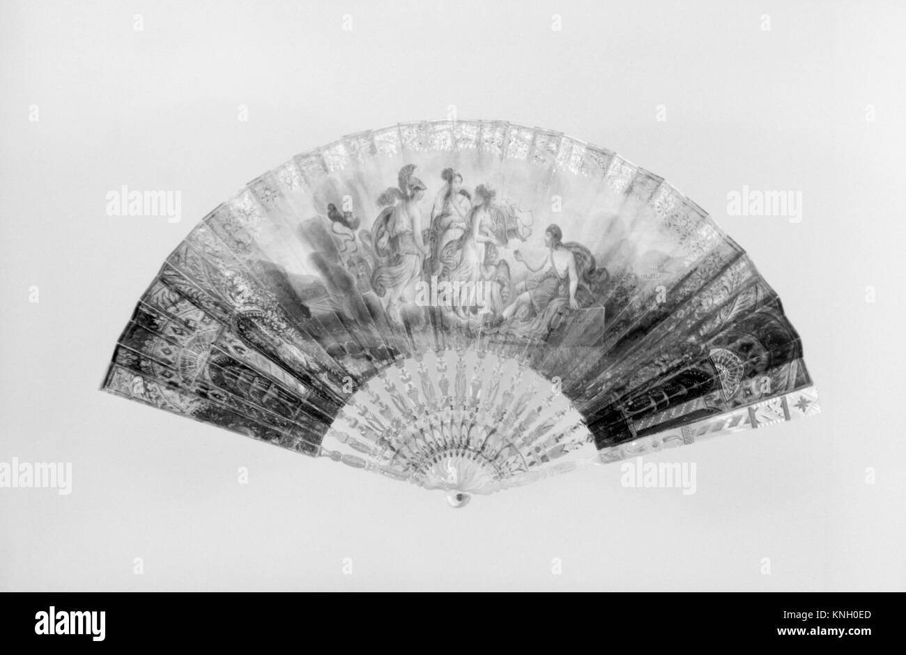 This fan, crafted with delicate materials, features intricate designs ...