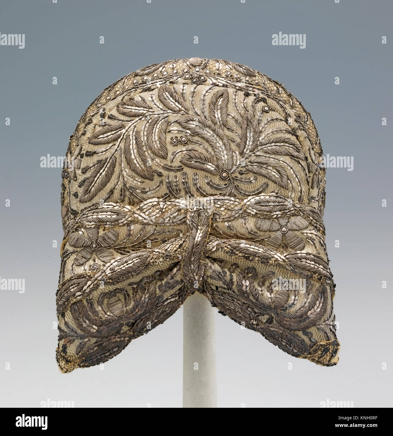 This cap, an example of period headwear, reflects the style and ...