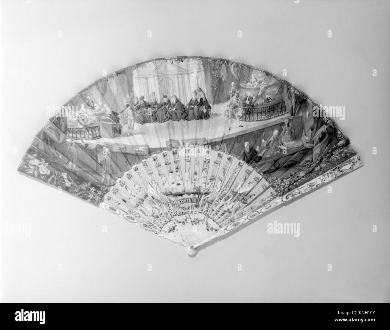 This decorative fan showcases intricate design, representing the ...