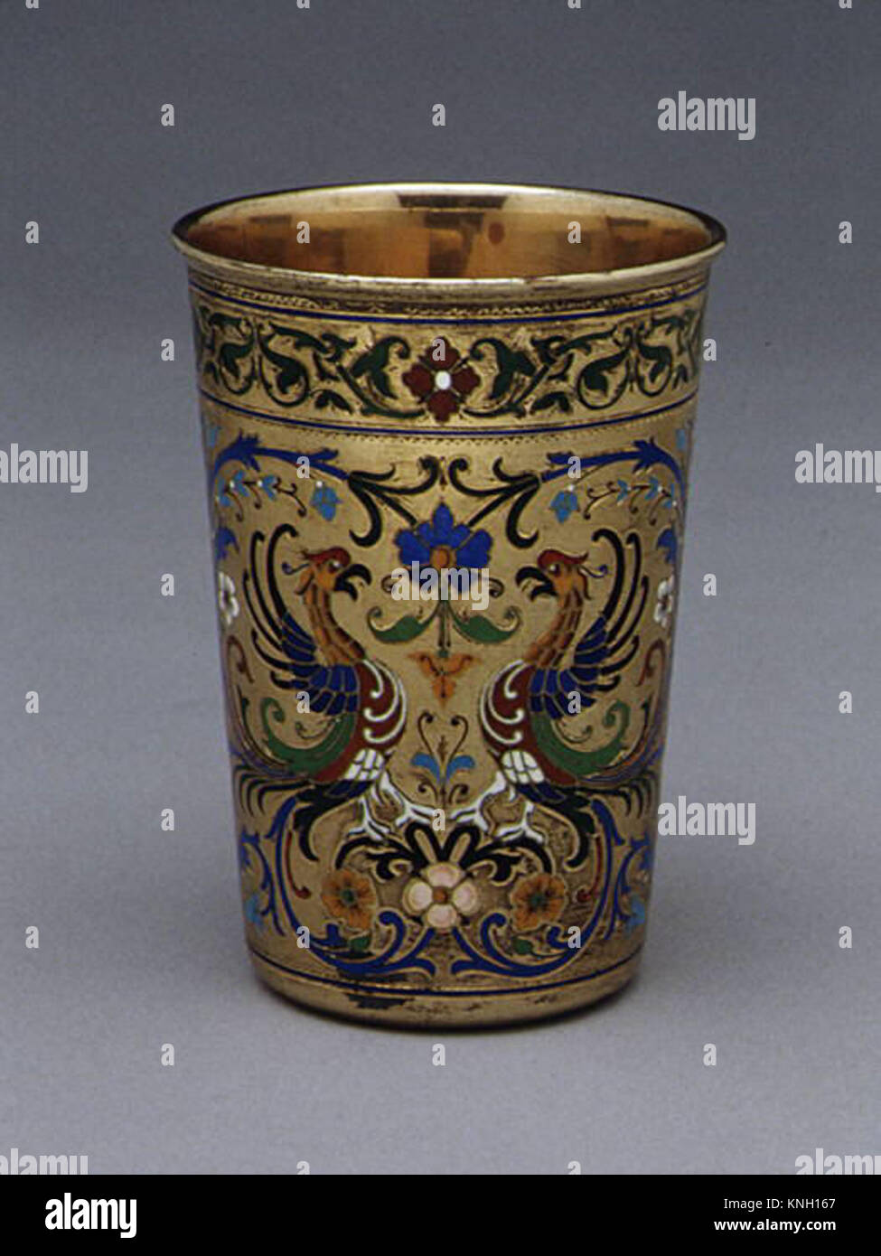 This beaker, crafted from clay, features simple geometric patterns and ...