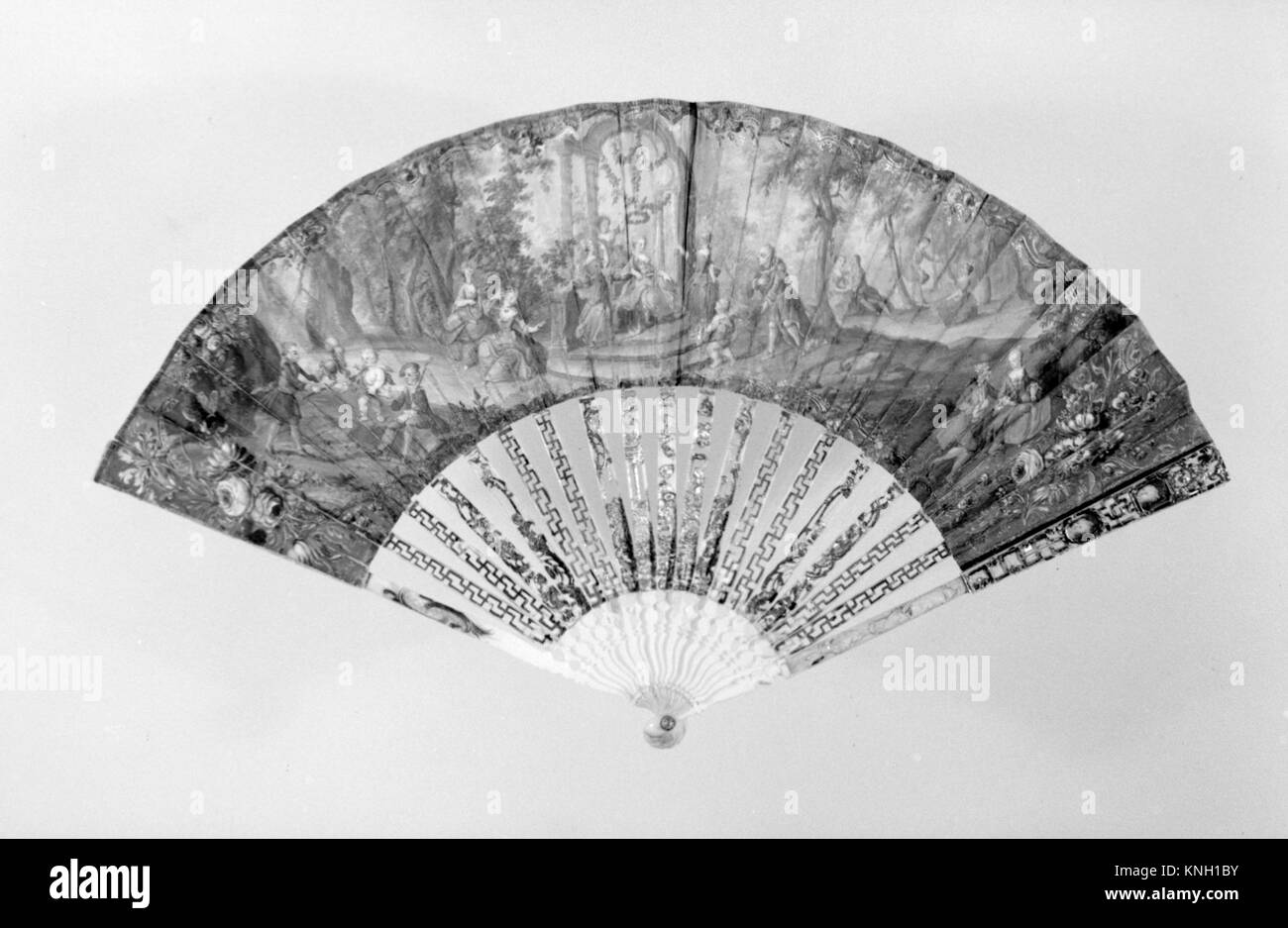 This fan, a delicate example of craftsmanship, served both a practical ...