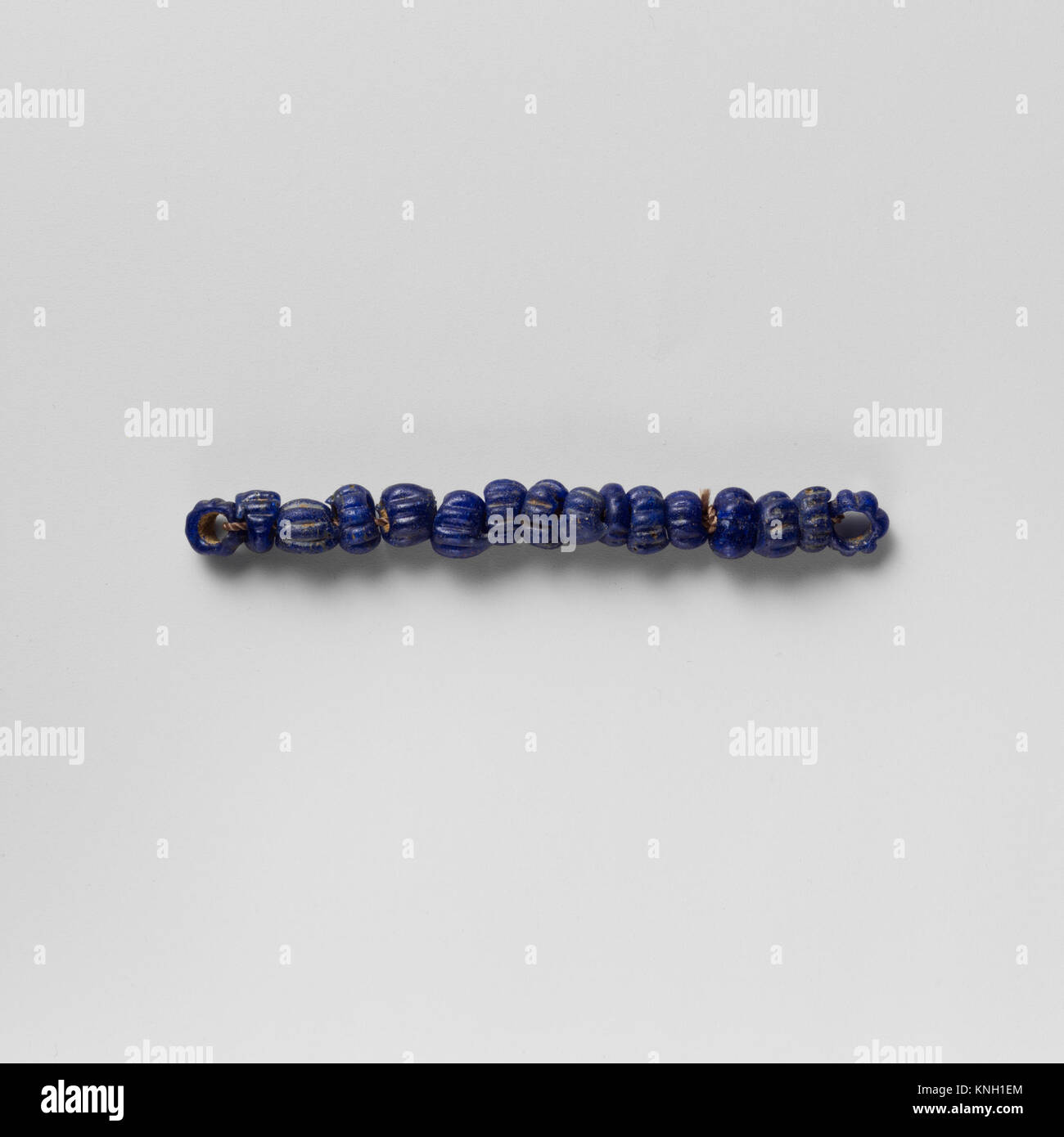 These glass beads, housed in the MET collection, represent the ...