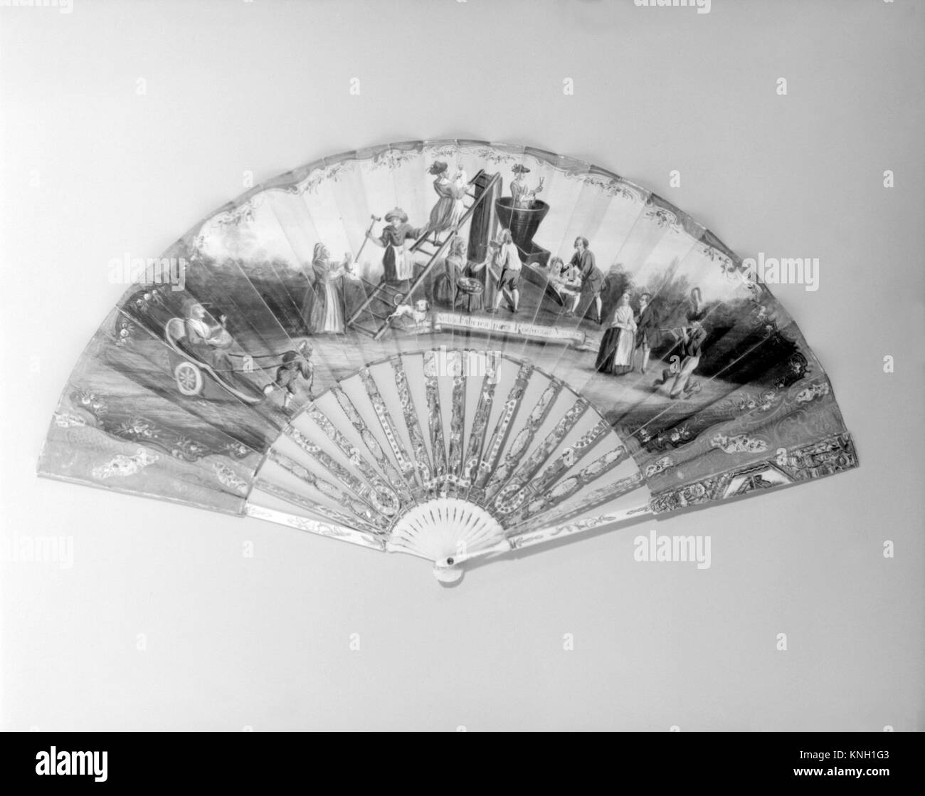 This fan, crafted from delicate materials, serves as both a functional ...