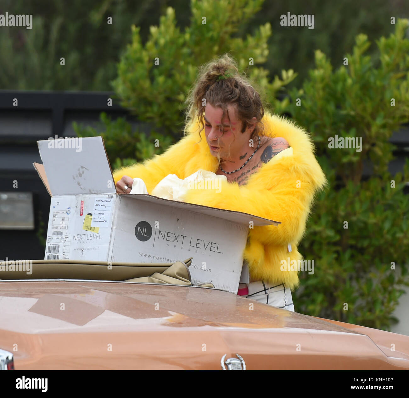 Mod Sun arrives in a vintage Cadillac Eldorado convertible with his dog ...