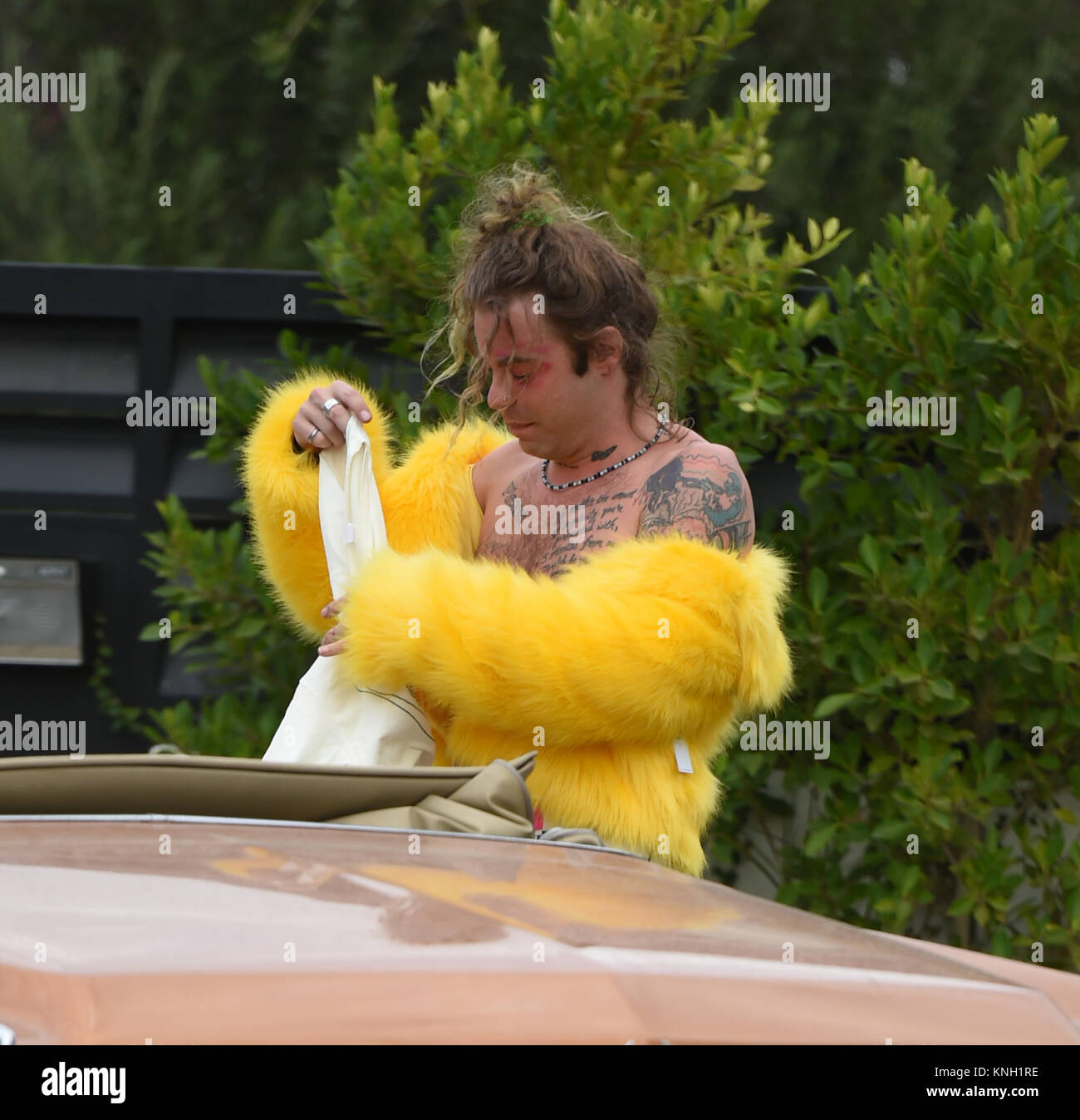 Mod Sun arrives in a vintage Cadillac Eldorado convertible with his dog ...