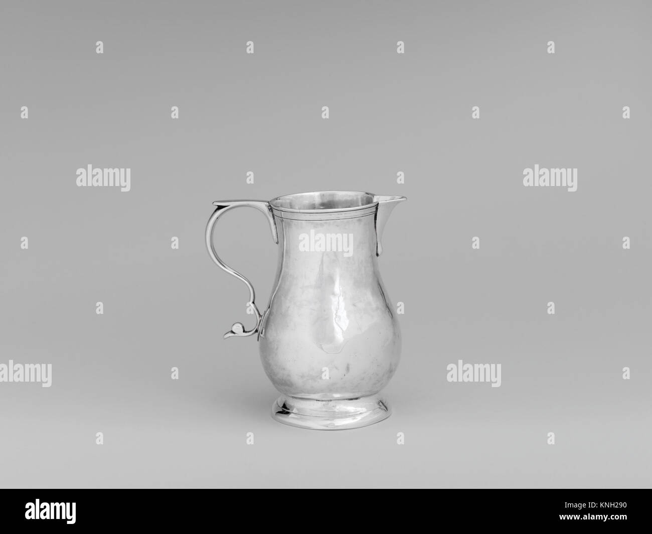 This silver creampot, made by American silversmith Jacob Hurd, dates to ...