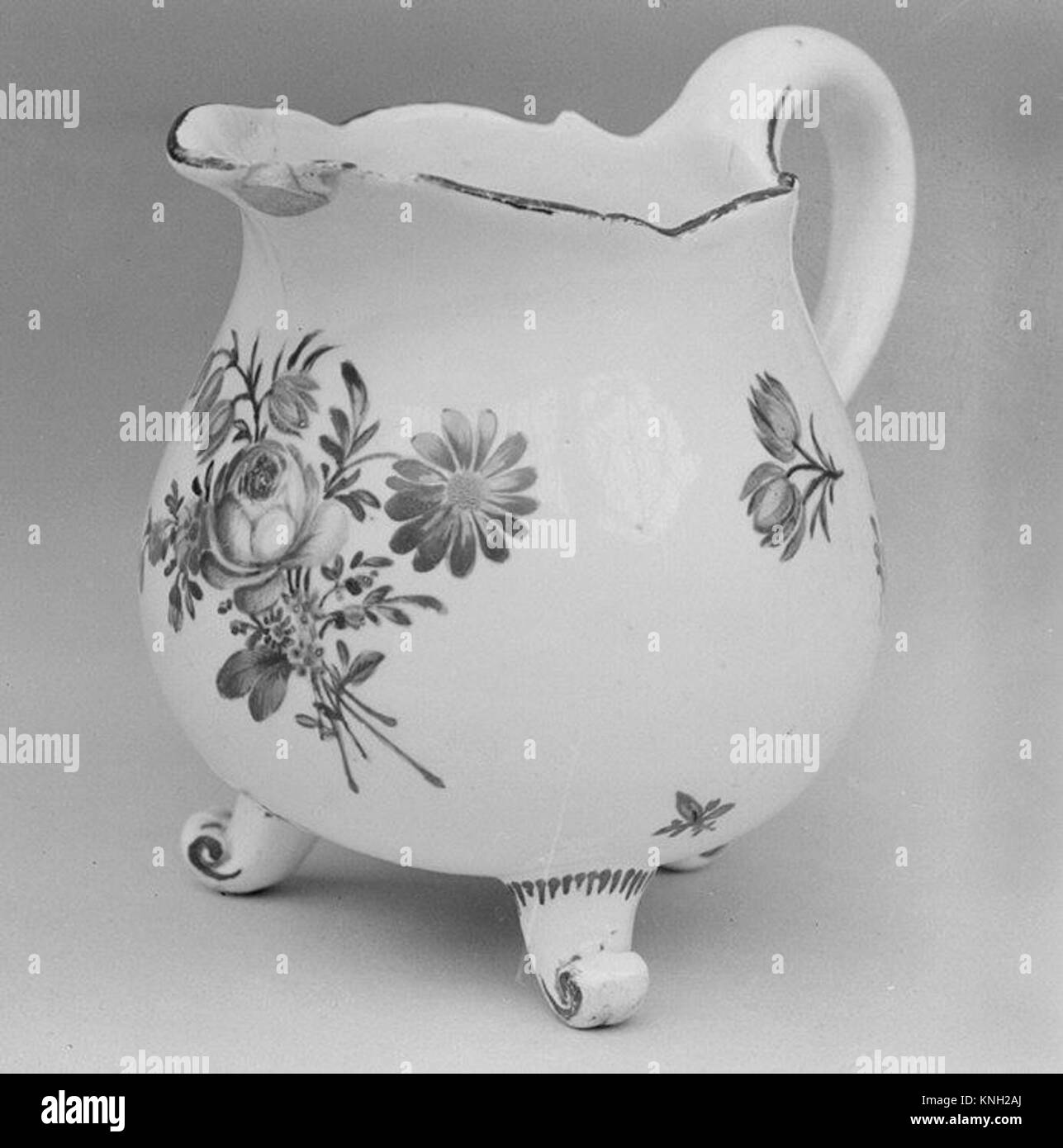 This cream jug is a fine example of antique ceramic ware, designed for ...