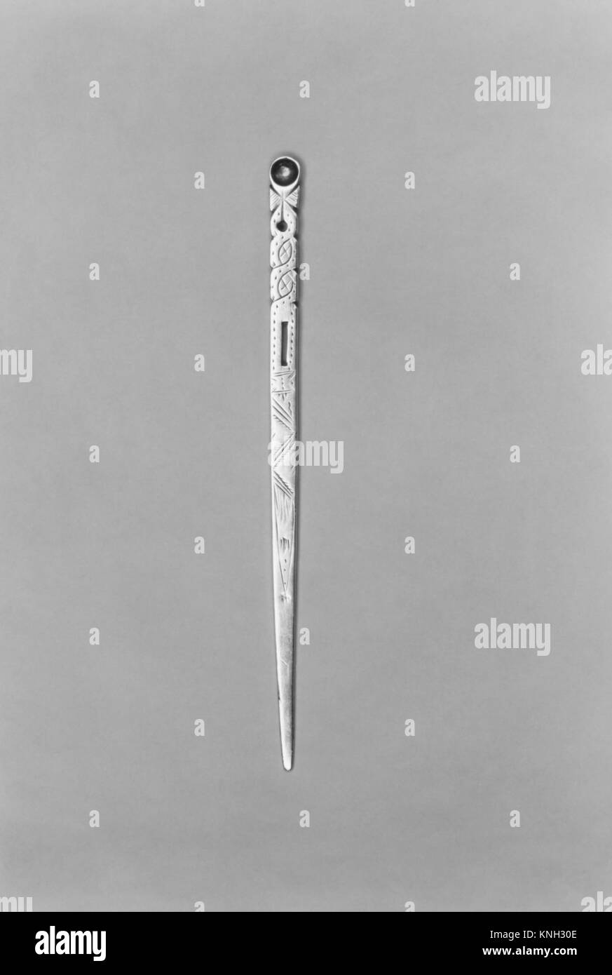 This bodkin is a metal needle or fastening tool used in ancient textile ...