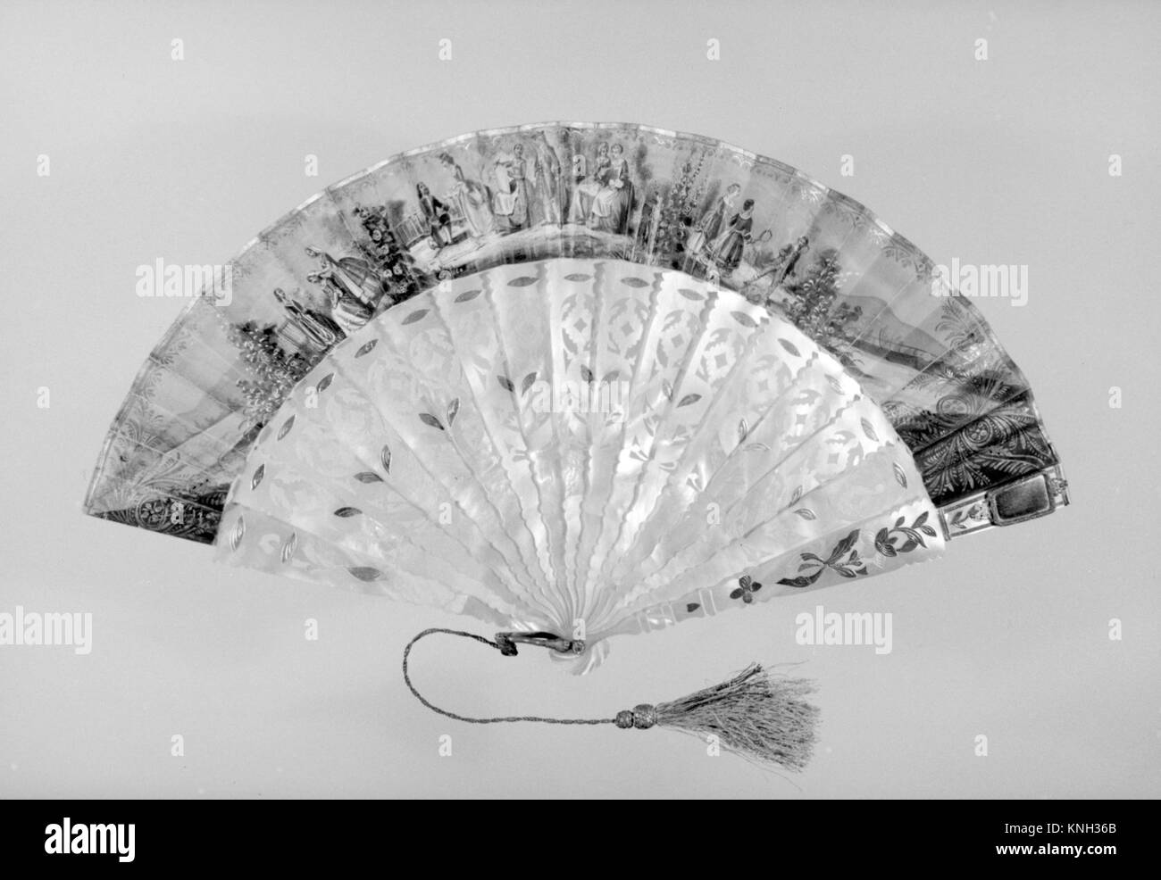 This fan is a decorative object, often used for personal cooling, that ...