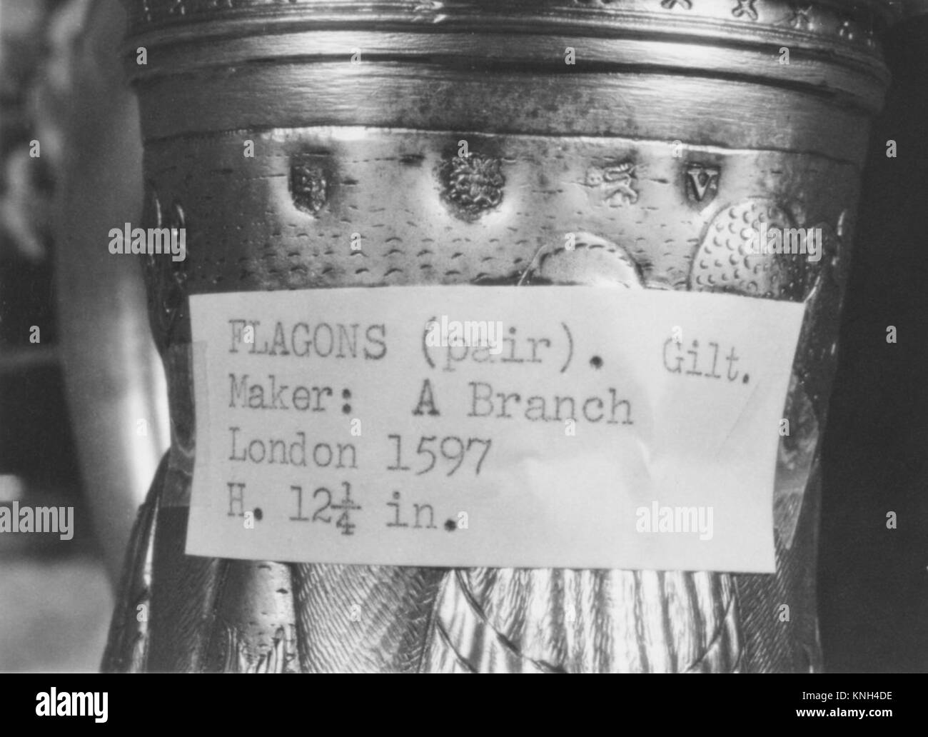 This flagon is one of a pair, made of metal, likely used for pouring ...