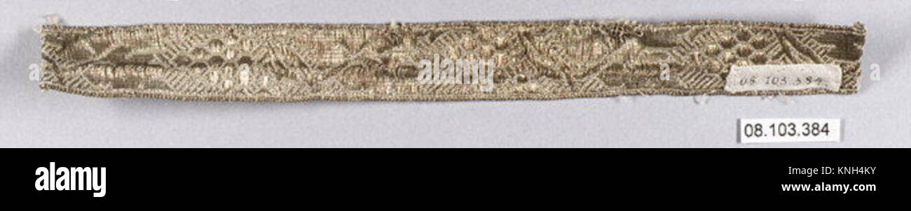 This galloon, a decorative trim or edging, was commonly used in the ...