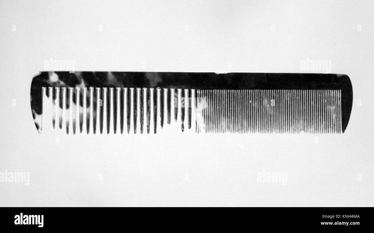 Ornate comb from a set, dating to the 19th century. Made of ivory with ...