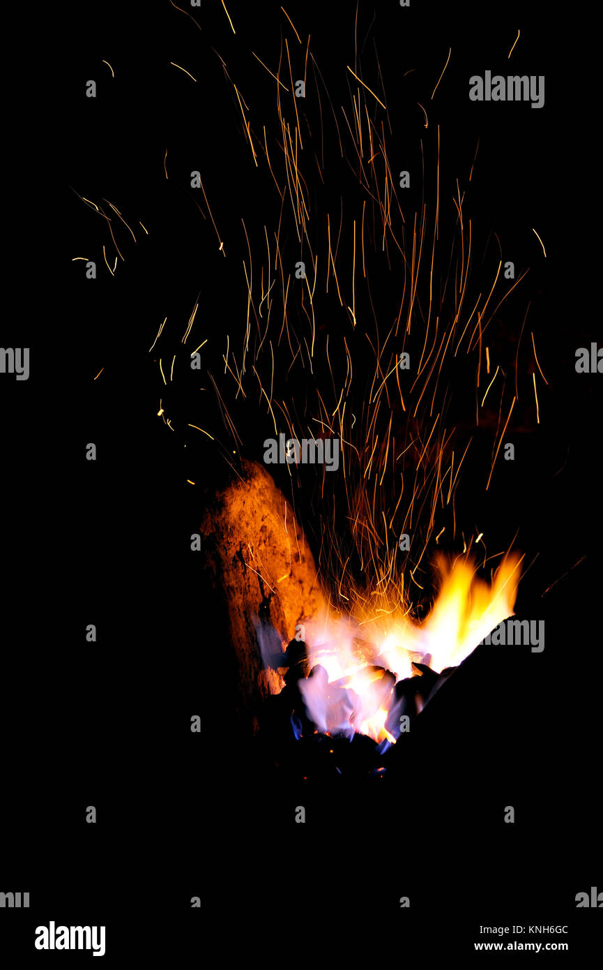 Smithy fire flame tips with sparks closeup on dark background Stock ...