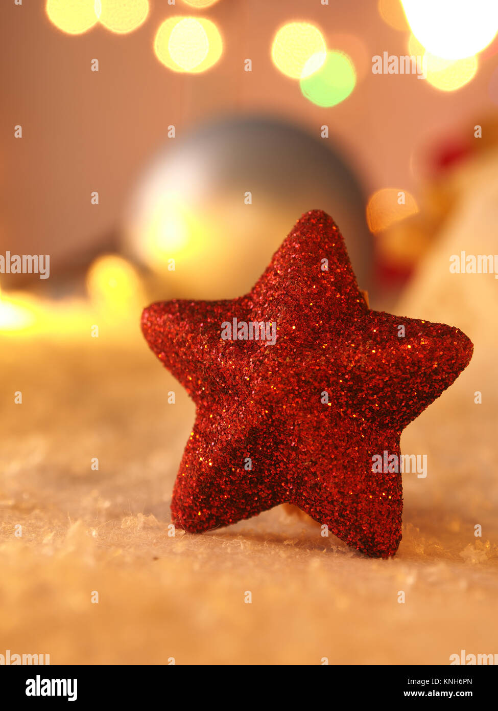 Close up of a red star shape in snow, Christmas background Stock Photo ...
