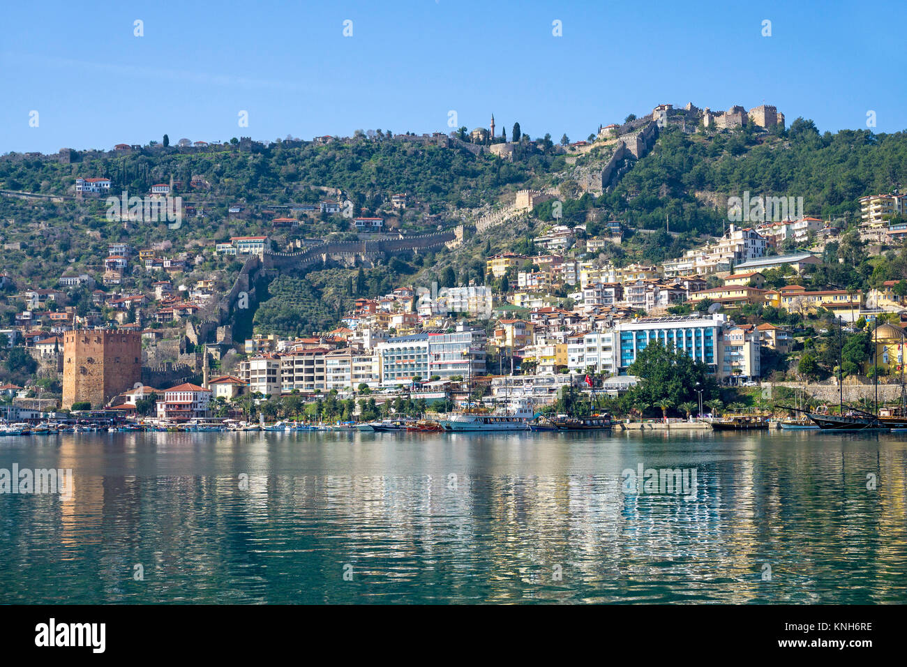 Harbour with red tower and castle hill with citadel, Alanya, turkish ...