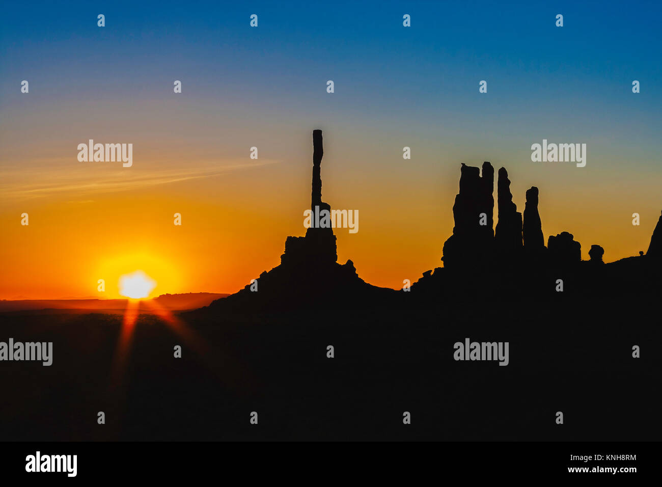 Iconic silhouettes of theTotem Pole and Yei Bi Chei rocky spires at ...