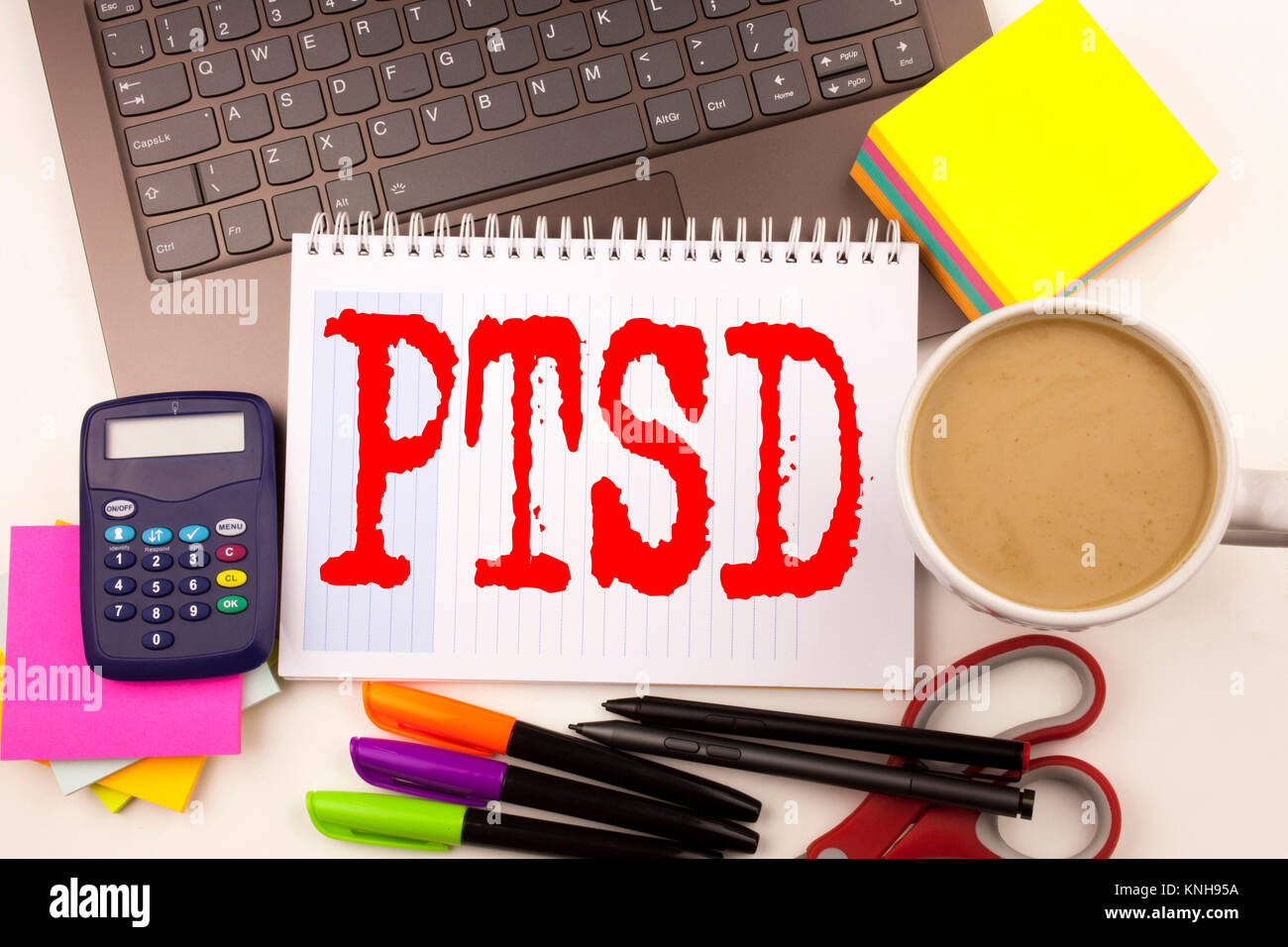 Word writing PTSD Post-Traumatic Stress Disorder in the office with ...