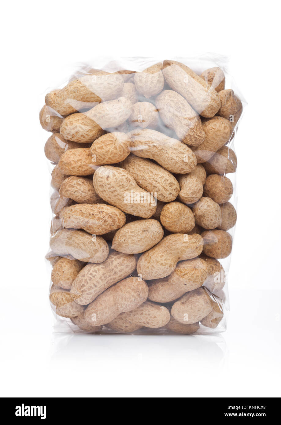 Clear pack of peanuts on white background Stock Photo - Alamy