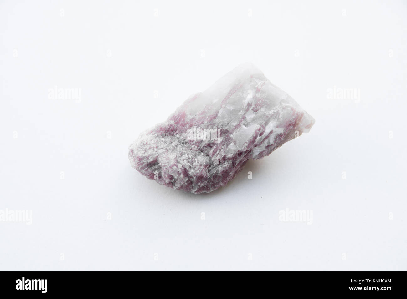 extreme close up of rubellit mineral isolated over white background ...
