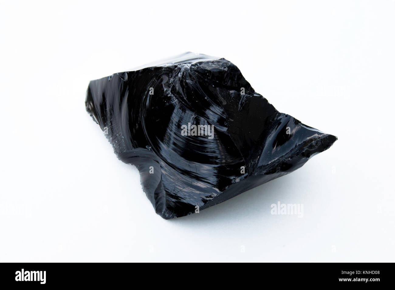 extreme close up of Obsidian mineral isolated over white background ...