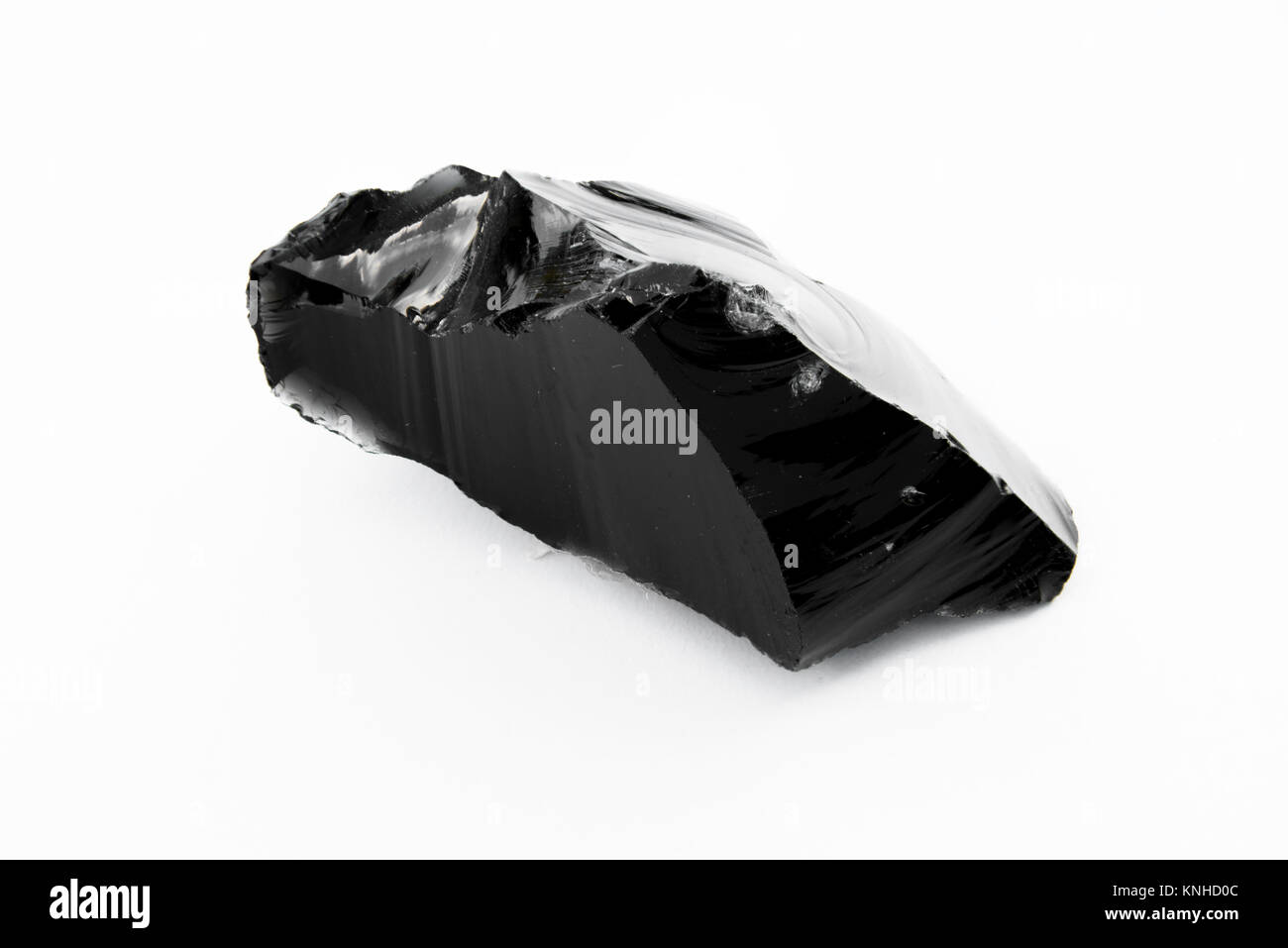 extreme close up of Obsidian mineral isolated over white background ...