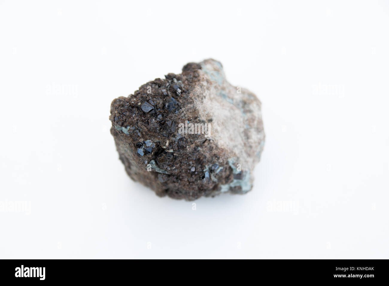 extreme close up of Andradite mineral isolated over white background ...