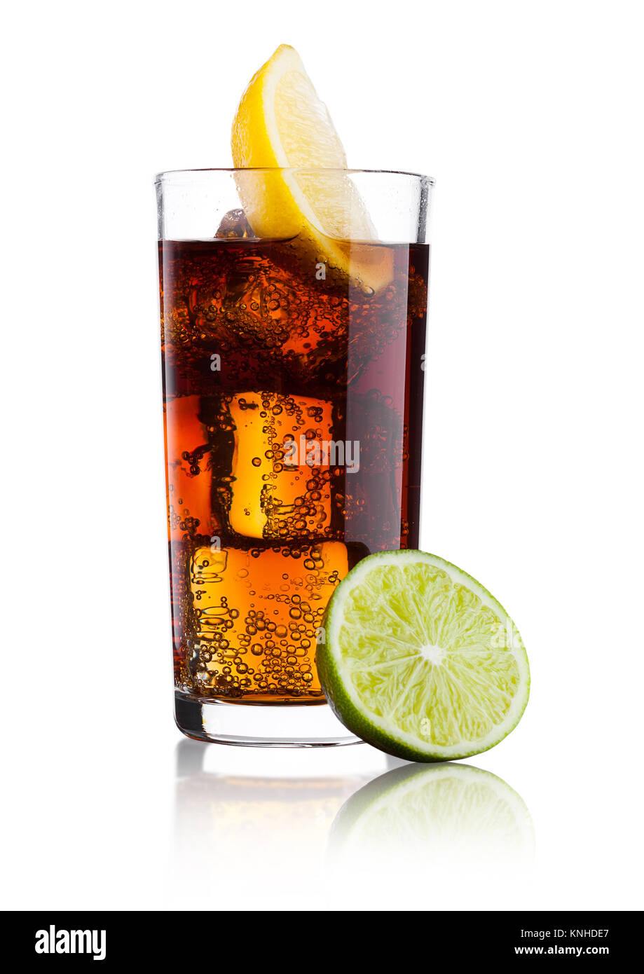 Glass of cold cola soda drink with lime and lemon on white background ...
