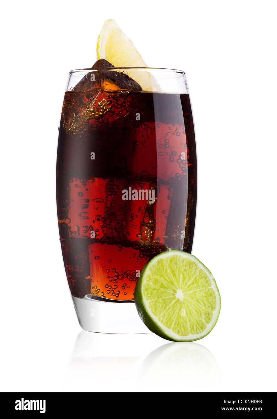 Glass of cold cola soda drink with lime and lemon on white background ...